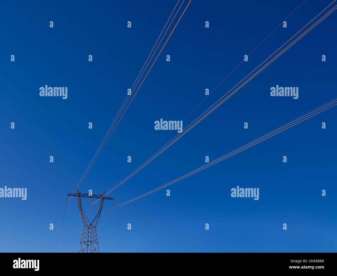 wire perspective electric tower on blue sky Stock Photo - Alamy