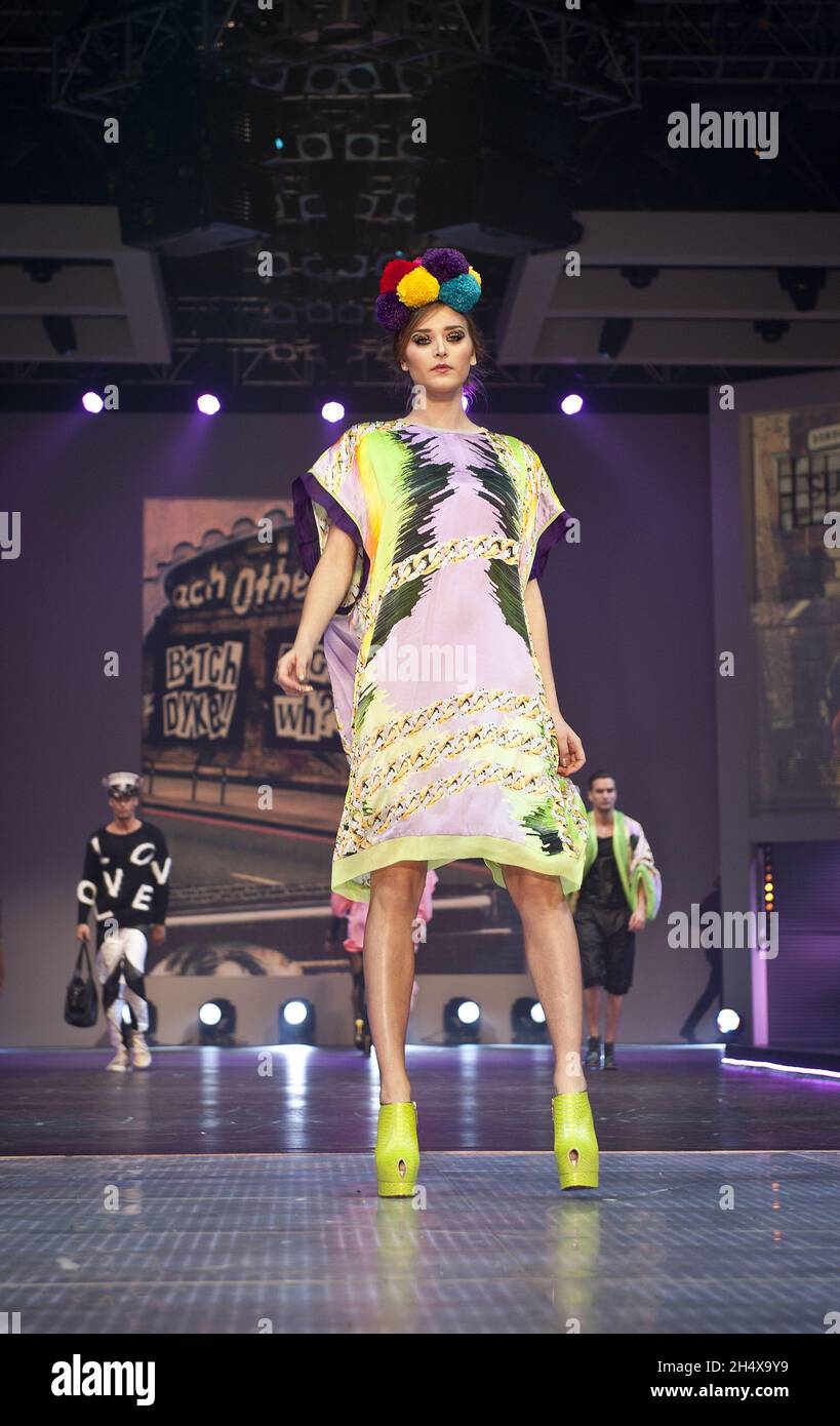 Female models walk down the catwalk in the Suzuki Fashion Theatre ...