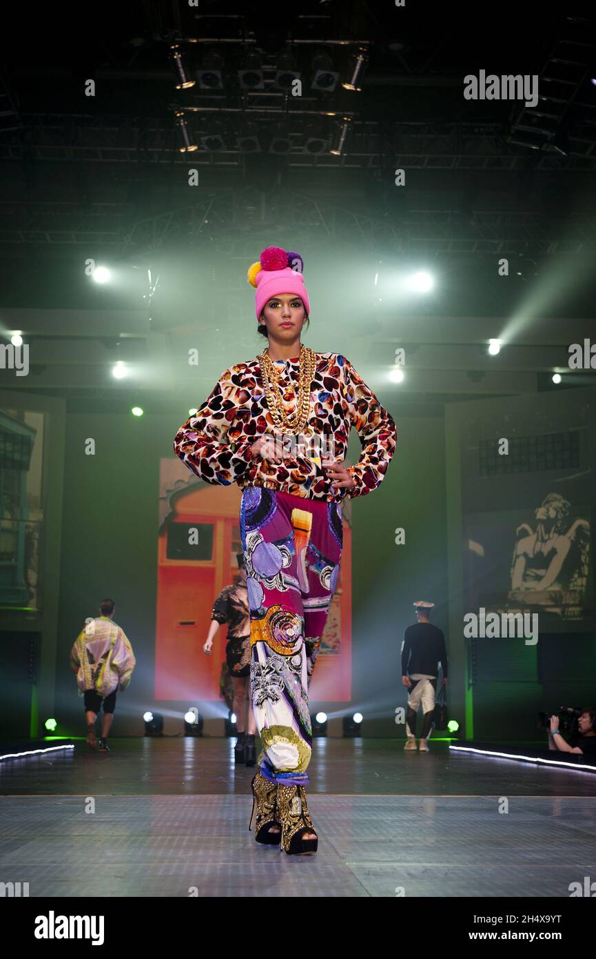 Female models walk down the catwalk in the Suzuki Fashion Theatre ...