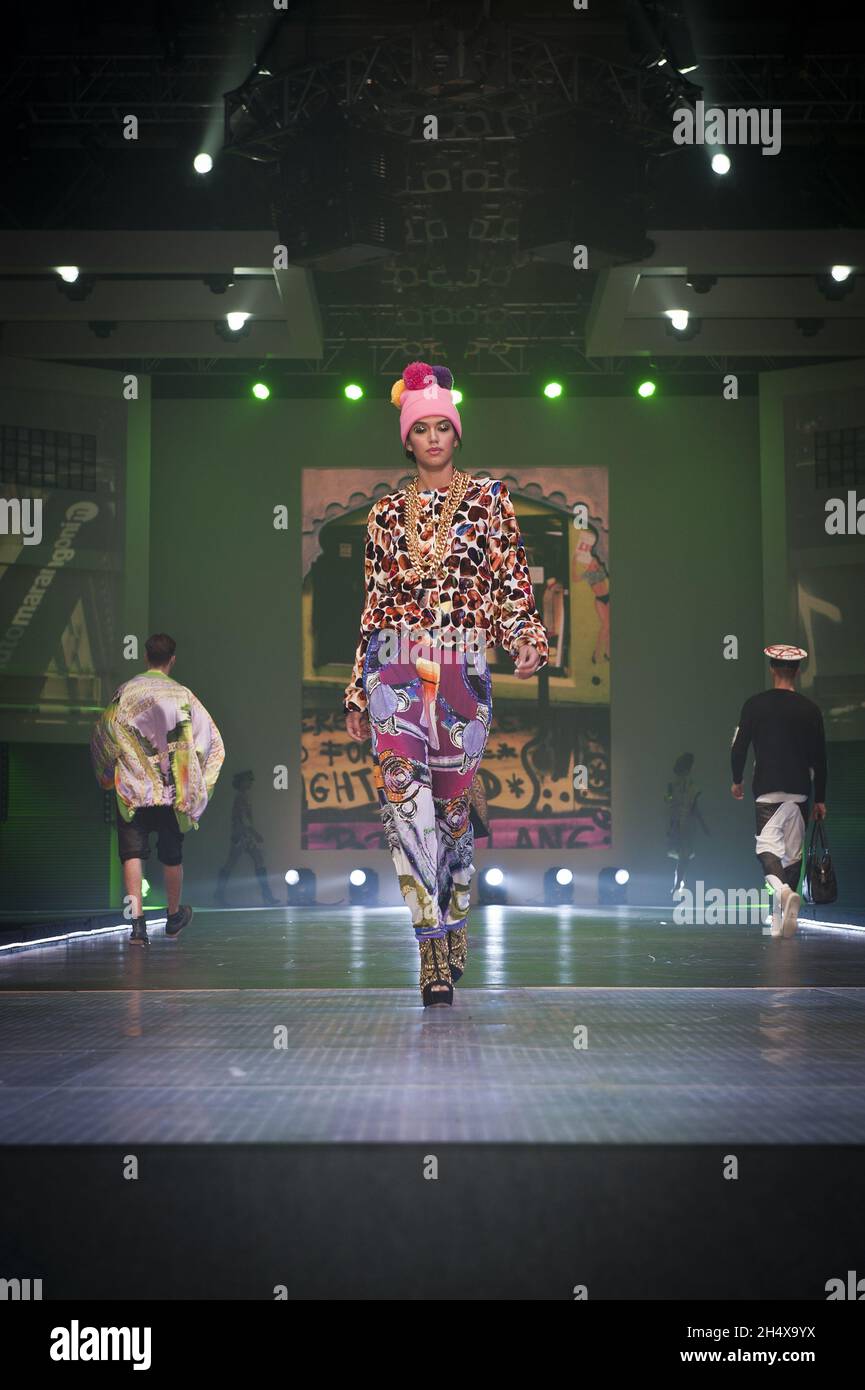 Female models walk down the catwalk in the Suzuki Fashion Theatre ...