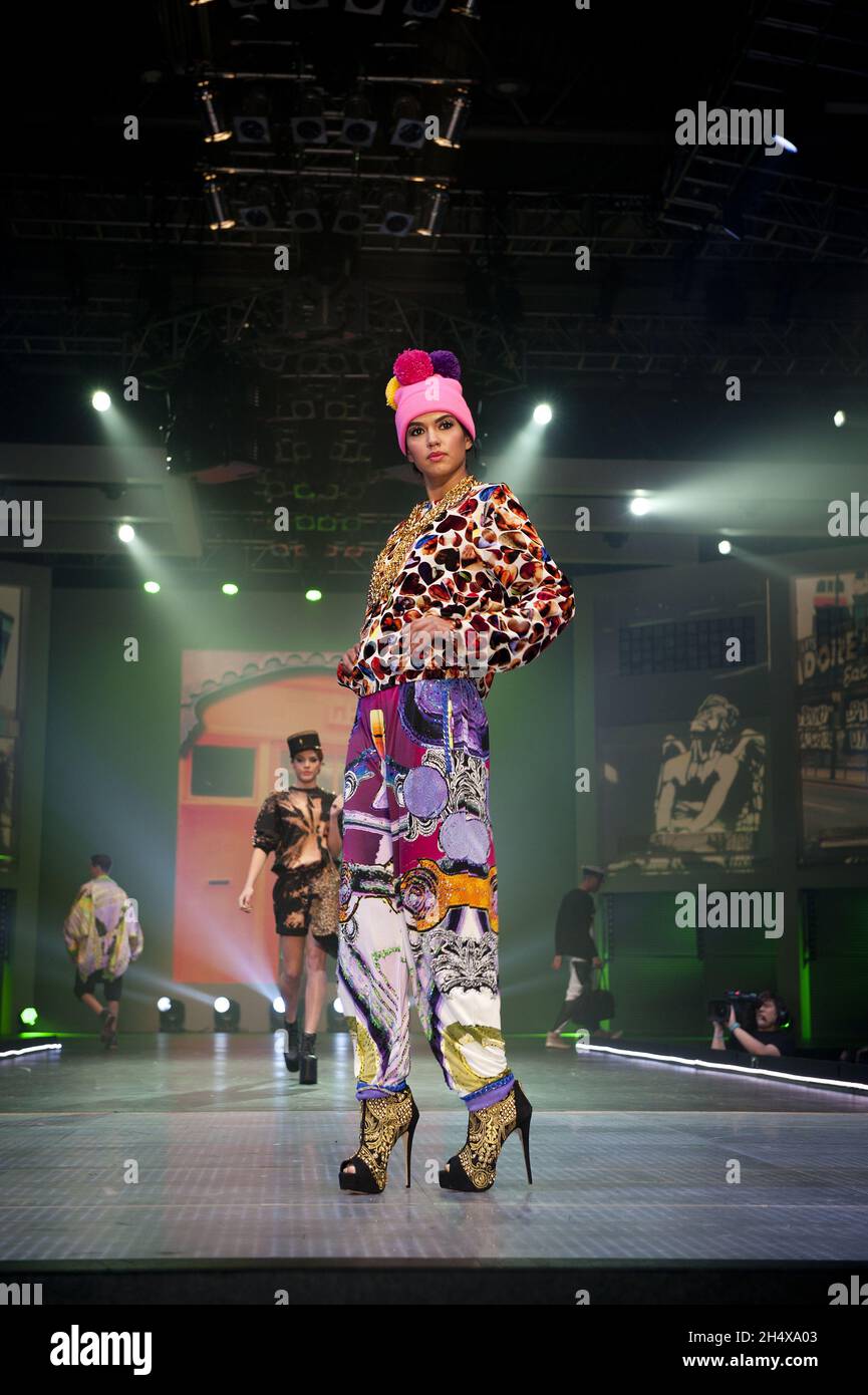 Female models walk down the catwalk in the Suzuki Fashion Theatre ...
