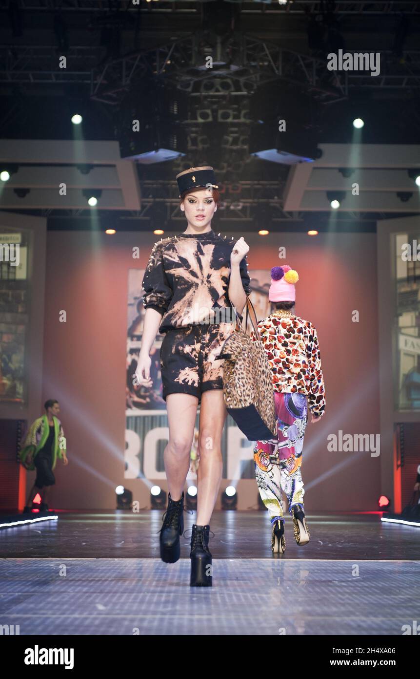 Female models walk down the catwalk in the Suzuki Fashion Theatre ...