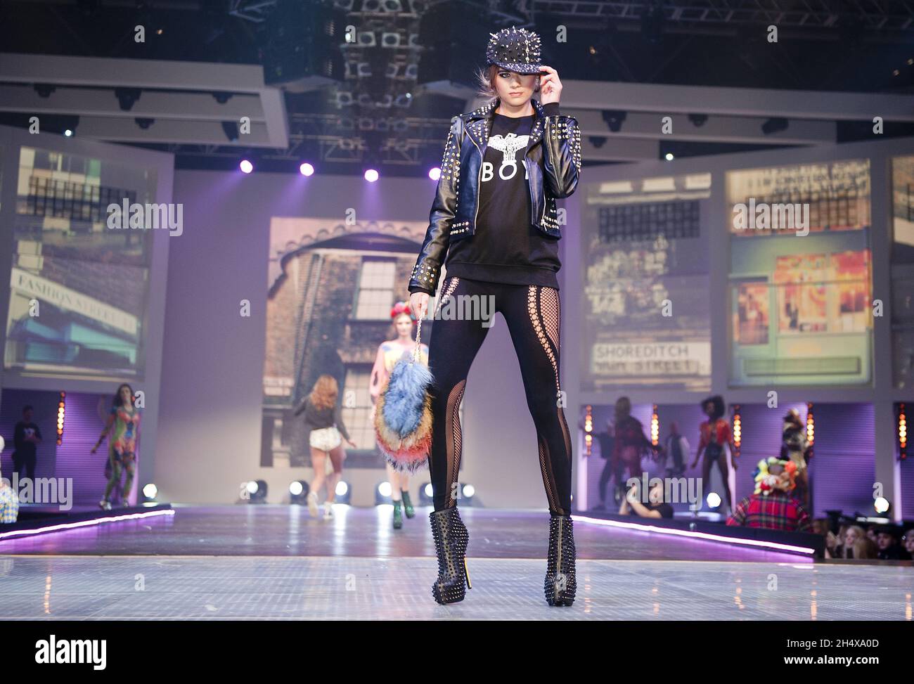 Female models walk down the catwalk in the Suzuki Fashion Theatre ...