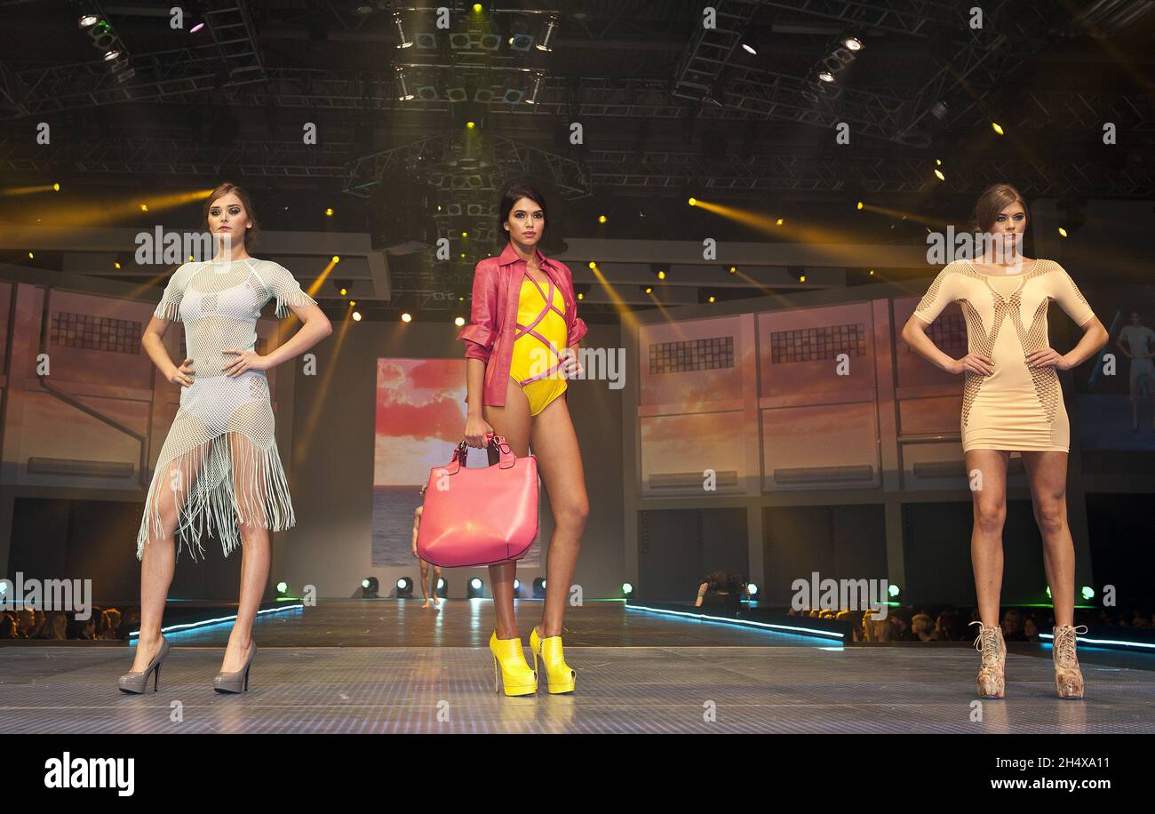 Female models walk down the catwalk in the Suzuki Fashion Theatre ...