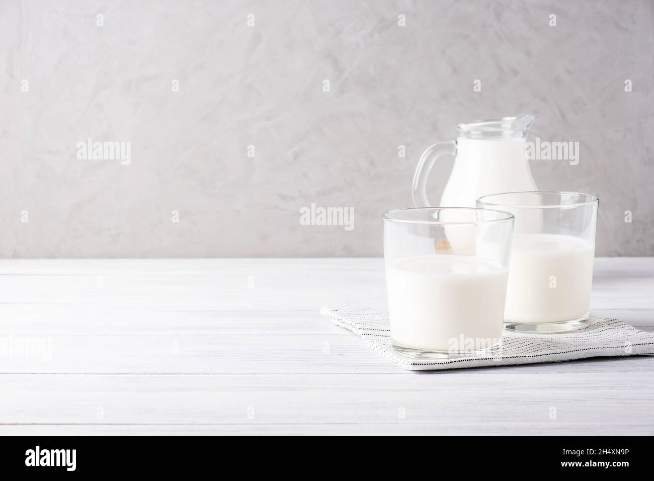 Glass serving vessels with milk. Healthy dietary food, dairy products ...