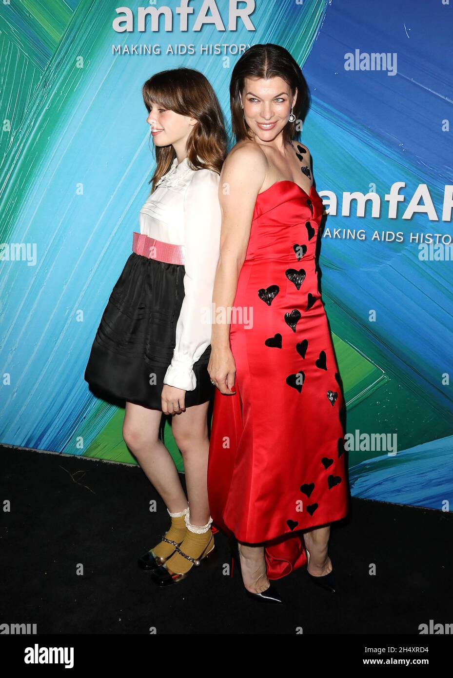 Ever Gabo Anderson and Milla Jovovich at the amfAR Gala Los Angeles ...