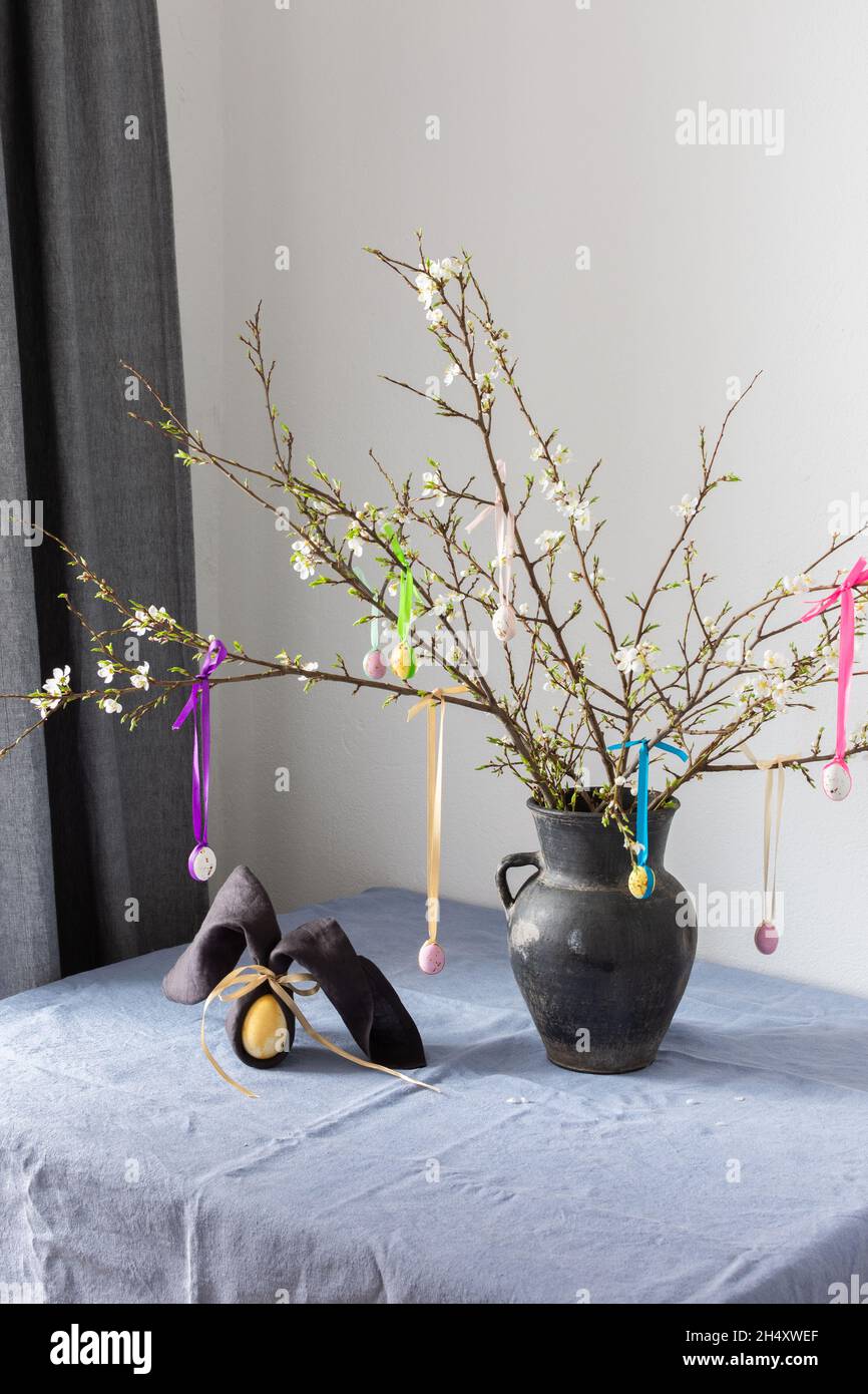 Blooming cherry branches decorated with colorful ribbons with Easter ...