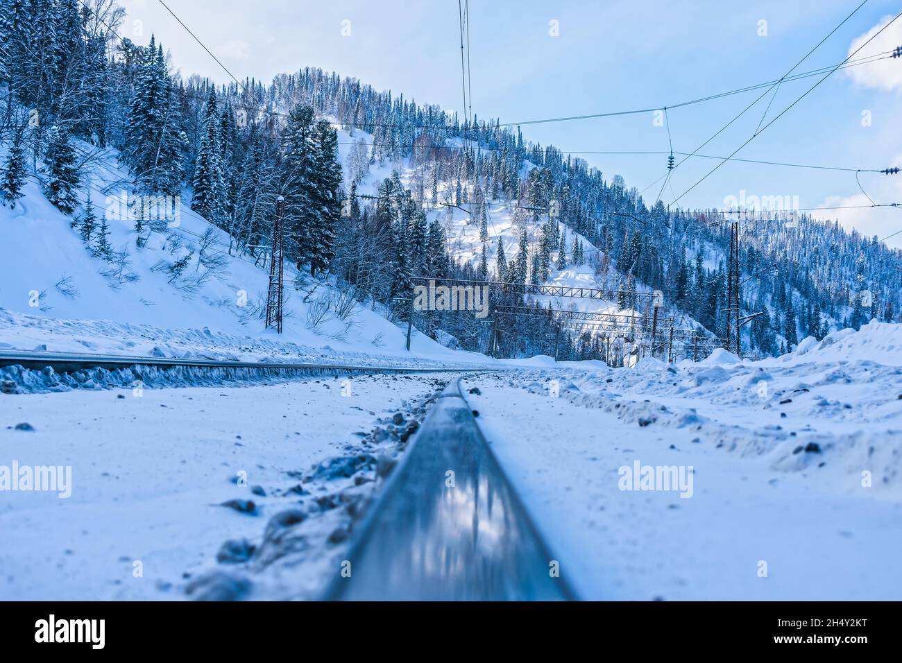 Train through snowy mountain hi-res stock photography and images - Alamy