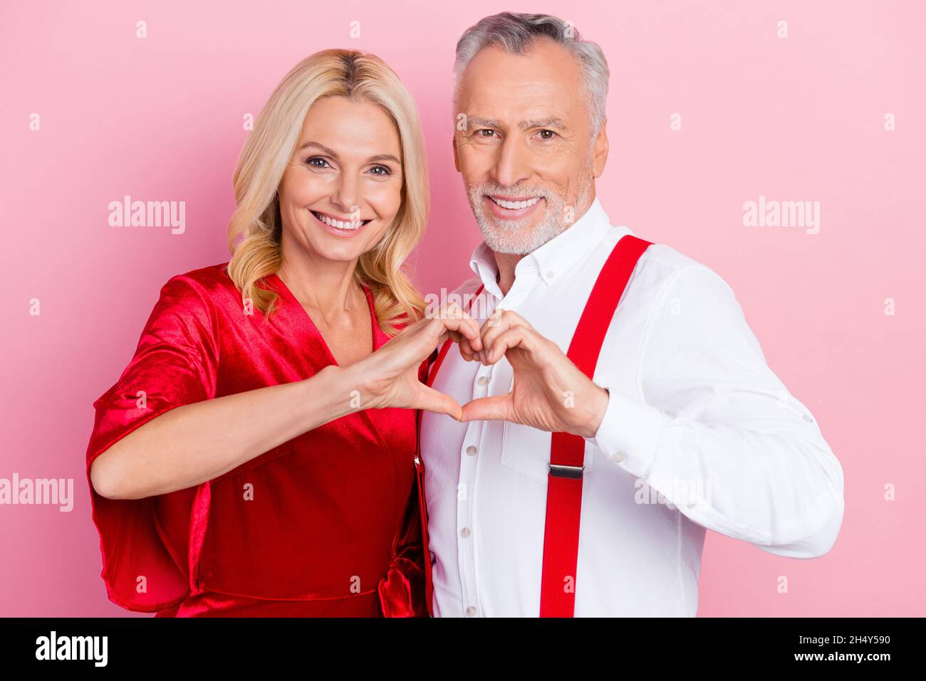 Portrait of two beautiful handsome cheerful spouses hugging showing ...