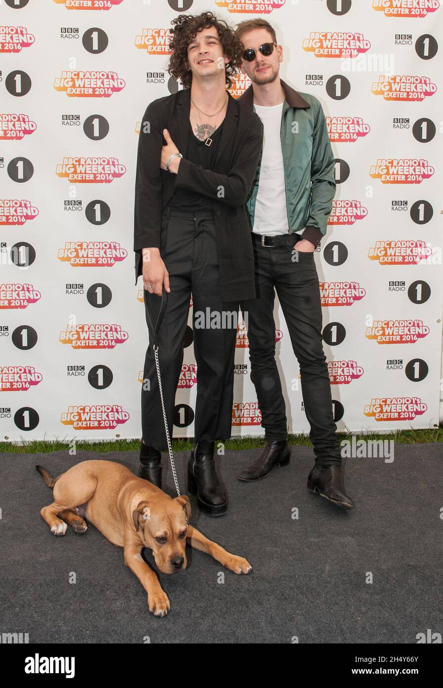 Matthew Healey and George Daniel of 1975 posing backstage accompanied ...