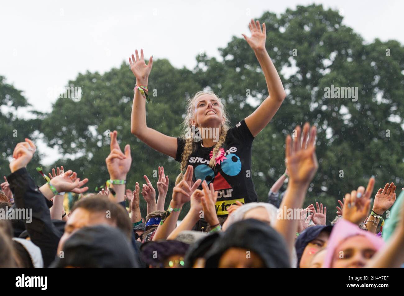 Festival goers having fun in the rain at V Festival 2016 at Weston Park ...