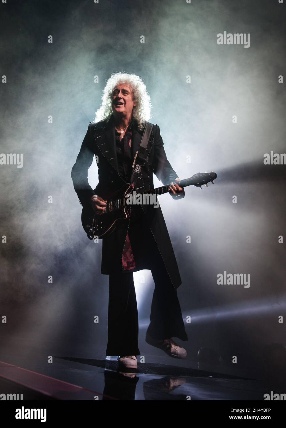 Brian May of Queen performing with Adam Lambert live on stage at Arena ...