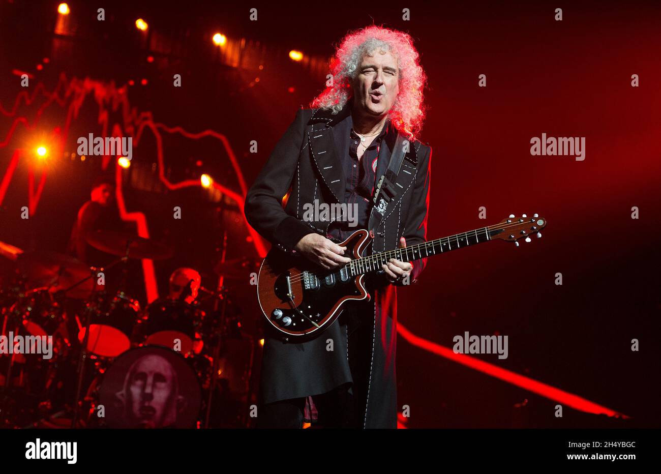 Brian May of Queen performing with Adam Lambert live on stage at Arena ...