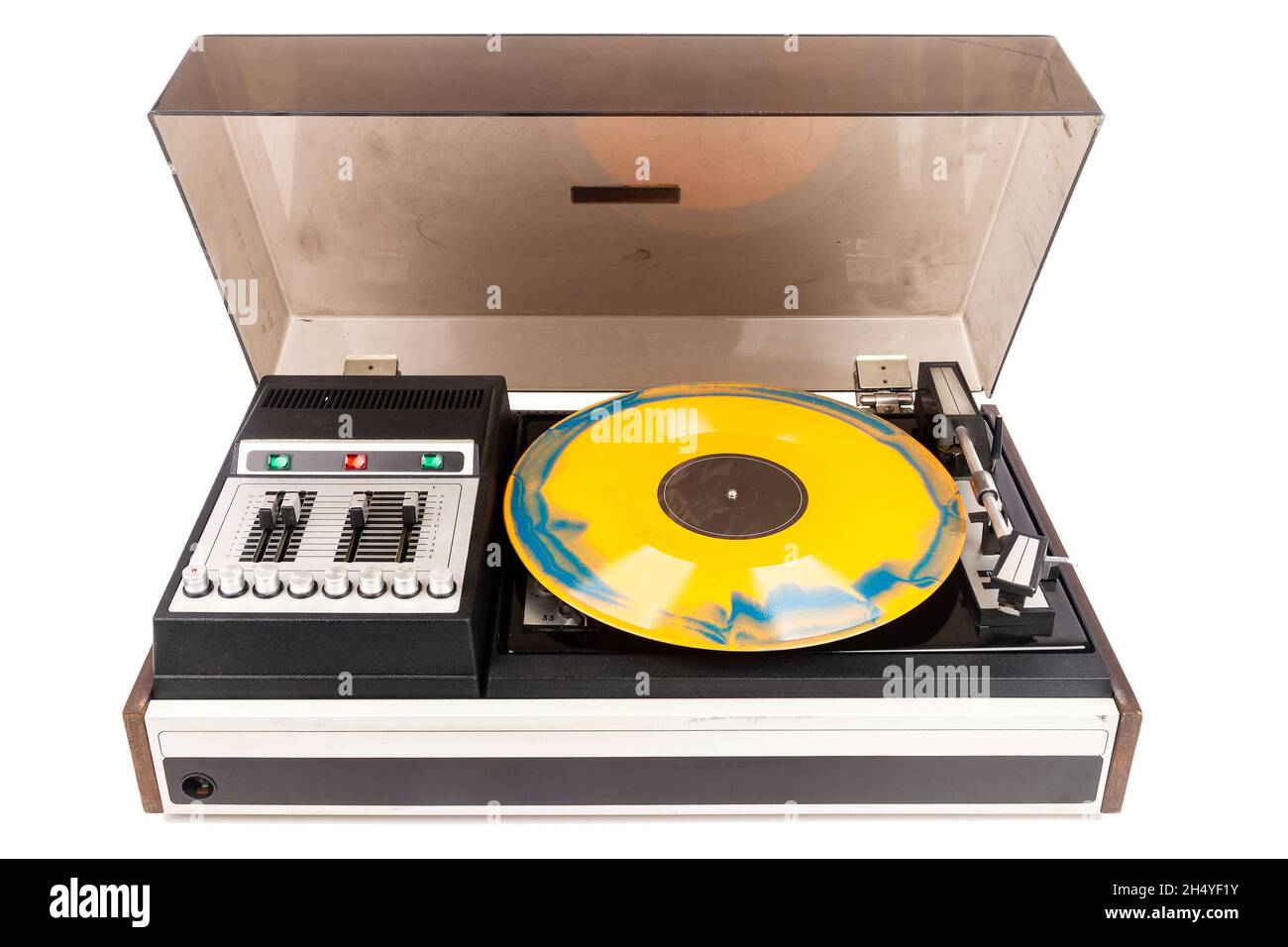 Vintage turntable record player with yellow vinyl isolated on white ...