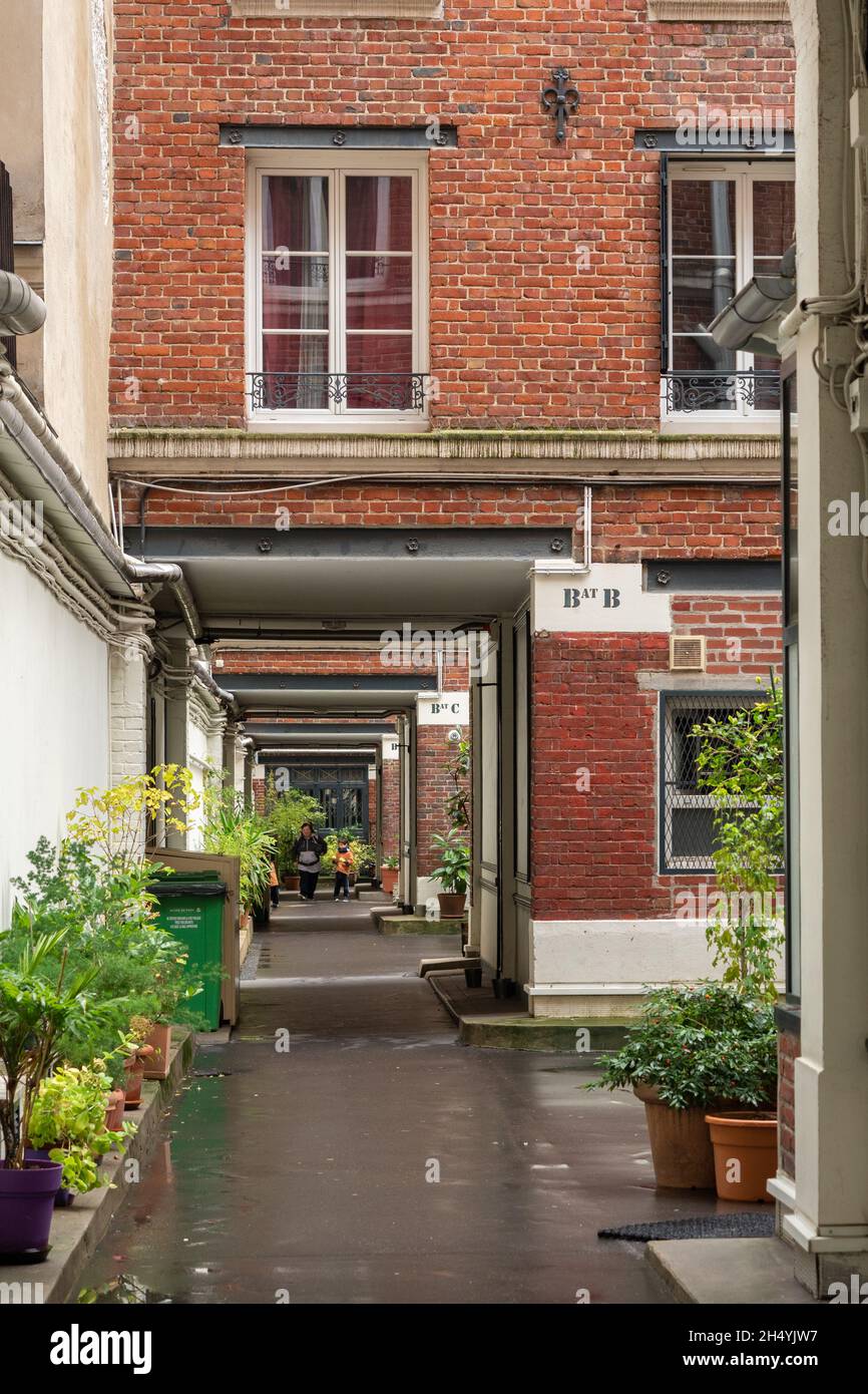 Paris, France - November 3rd 2019: A row of courtyards surrounded by ...