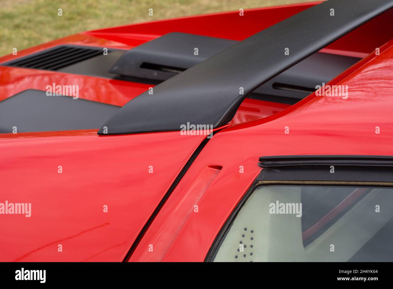 Close up detail of the engine deck cover on the rear of a red 1970s ...