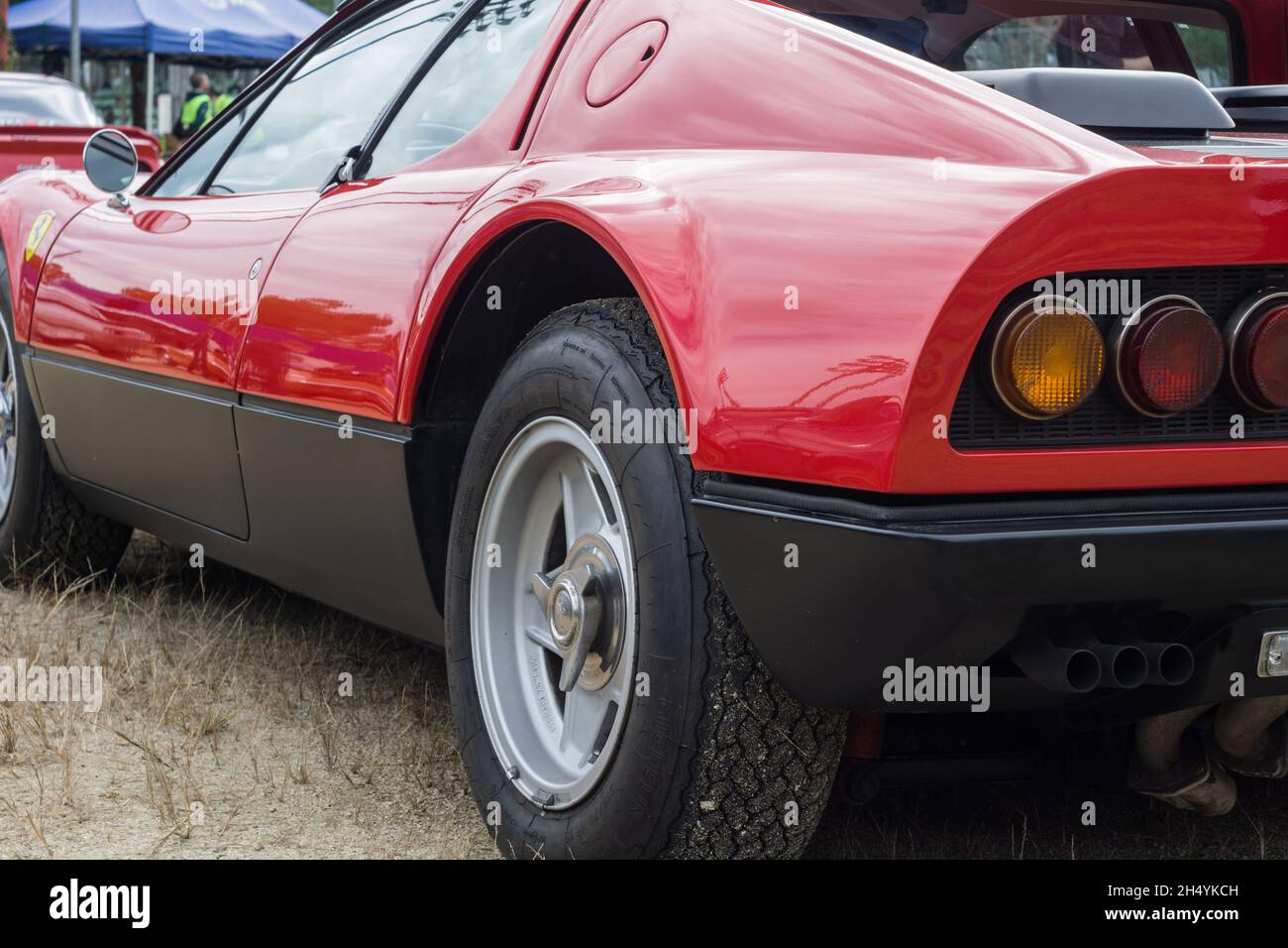 Close up detail of the wheel arch, side and rear of a red 1970s Ferrari ...