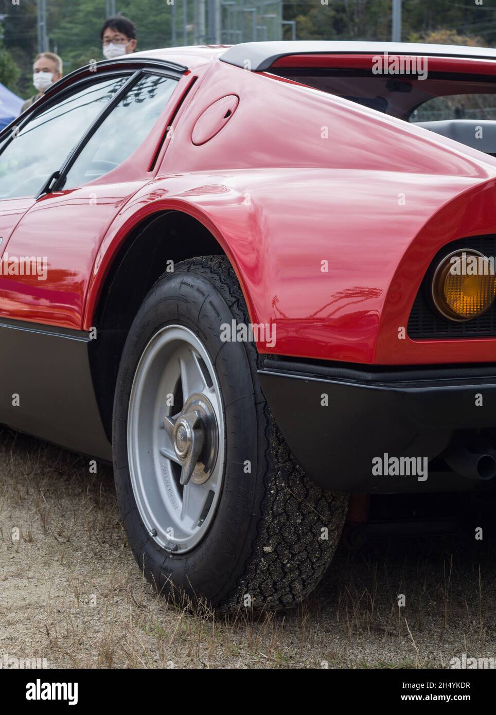 Close up detail of the wheel arch, side and rear of a red 1970s Ferrari ...