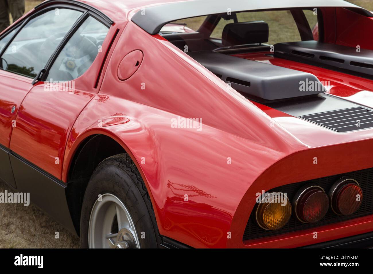Close up detail of the wheel arch, side and rear of a red 1970s Ferrari ...