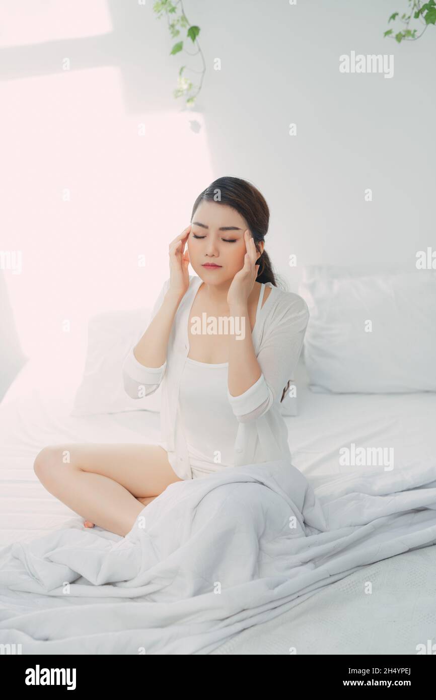 Stressed unhappy female feels dizziness Stock Photo - Alamy