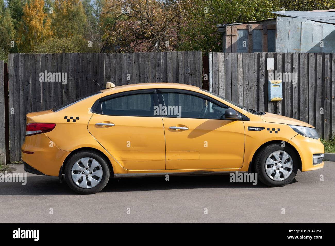 Taxi without brand on the street in front of houses in Moscow, Russia ...