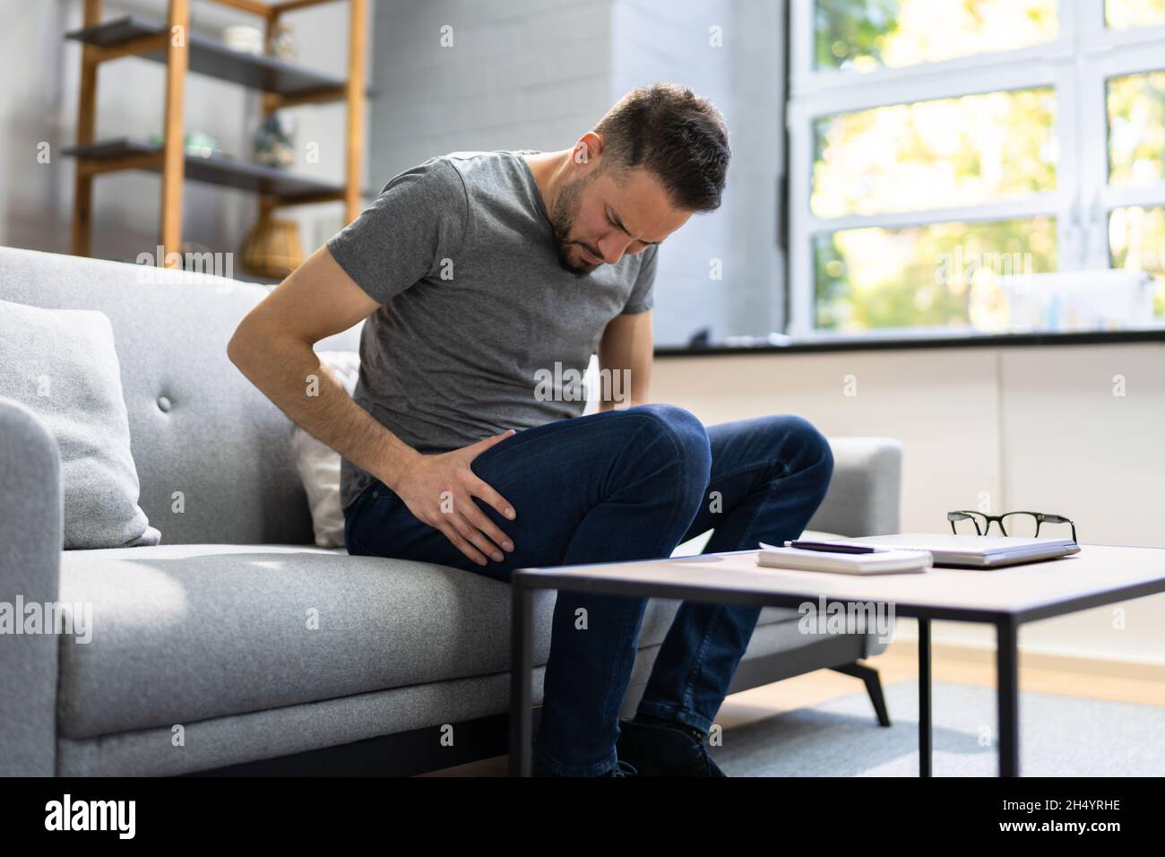 Leg Cramp And Spasm Ache. Sore Quadriceps At Home Stock Photo - Alamy