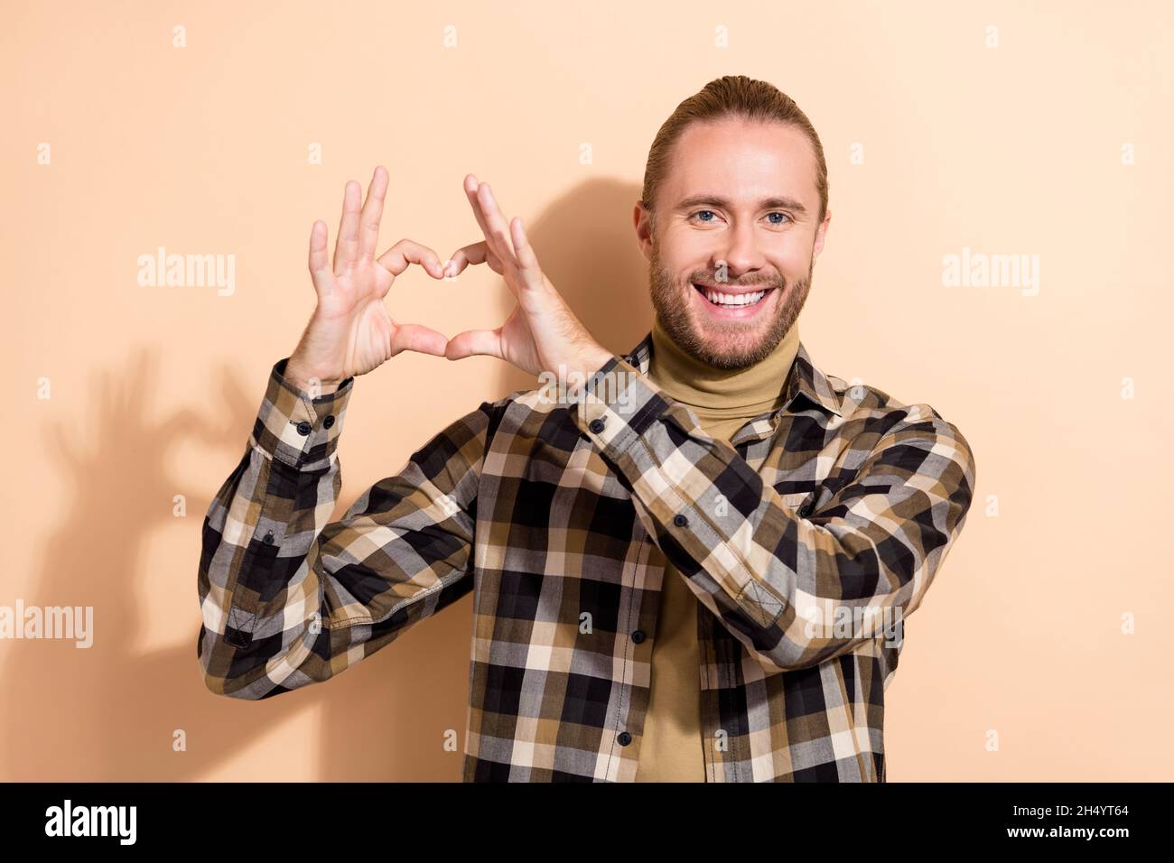 Photo of young guy cool good mood show hands heart symbol romantic ...