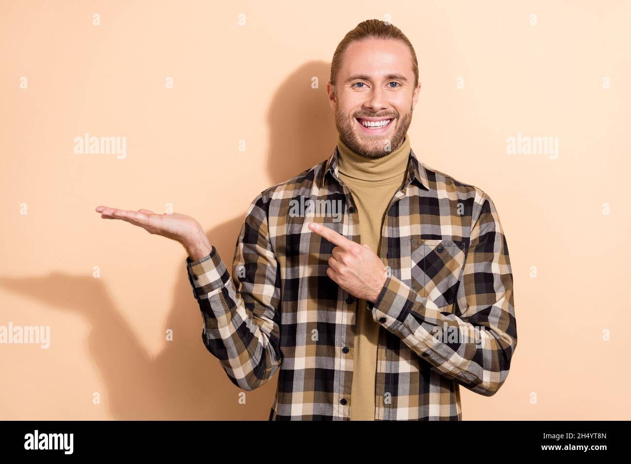 Photo of young guy indicate finger product advert suggest discount ...