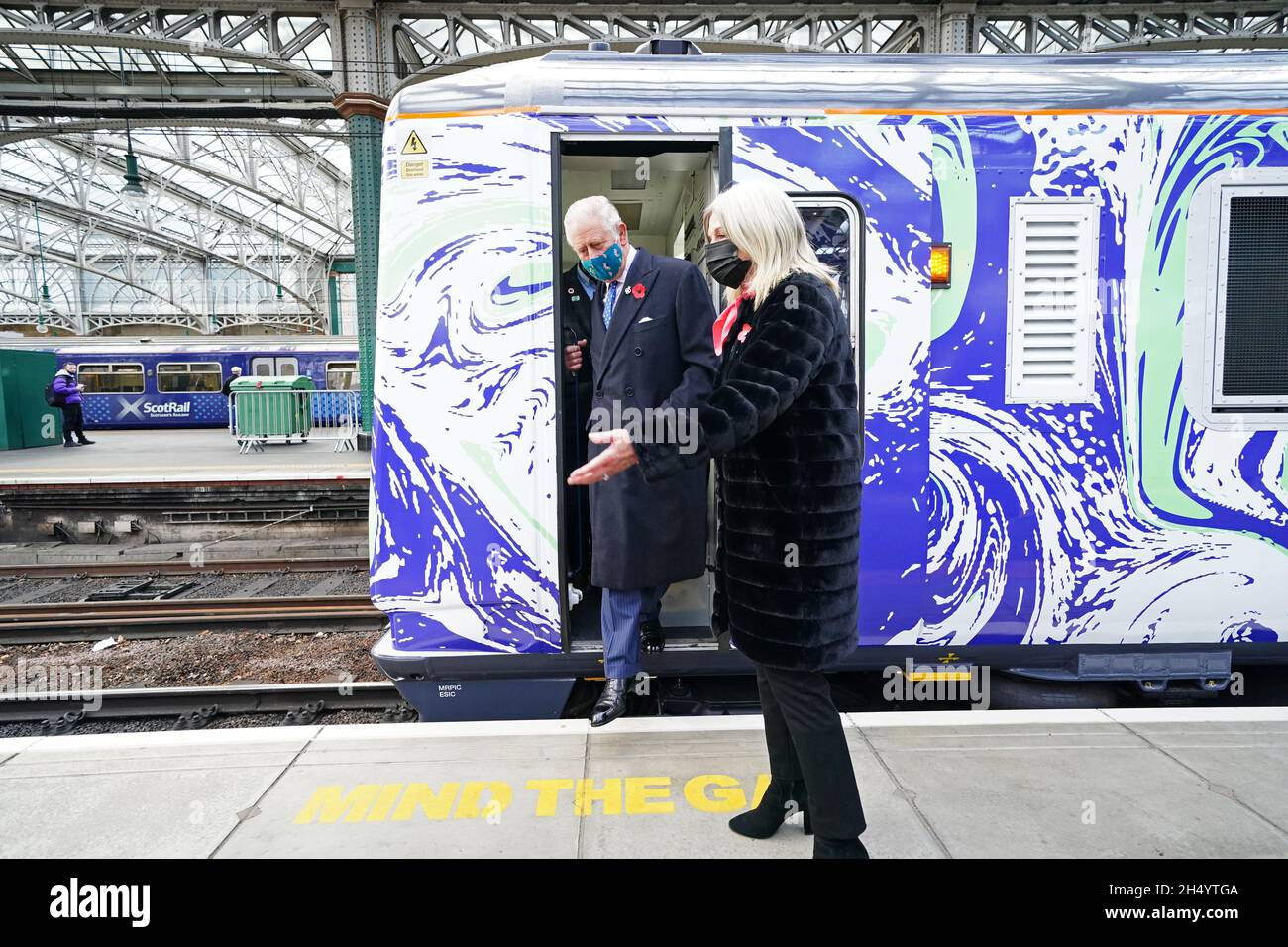 The Prince of Wales steps off a hydrogen powered train, one of two ...
