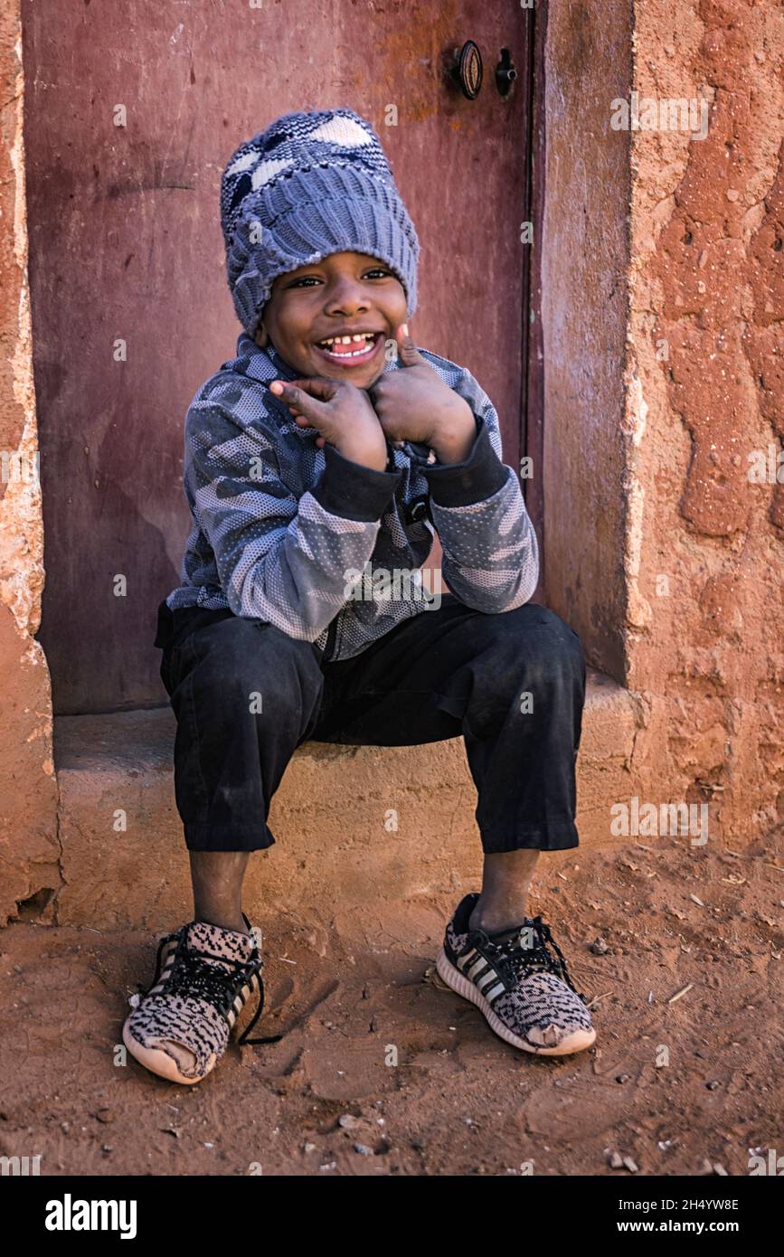poor child smiles to life Stock Photo - Alamy