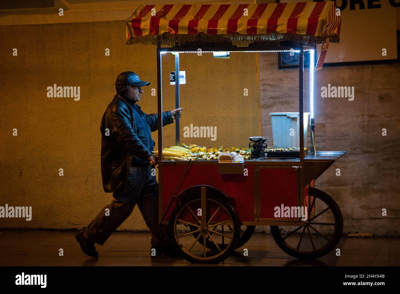 ISTANBUL, TURKEY - MARCH 18 2013: A man pulling a cart of corn Stock ...