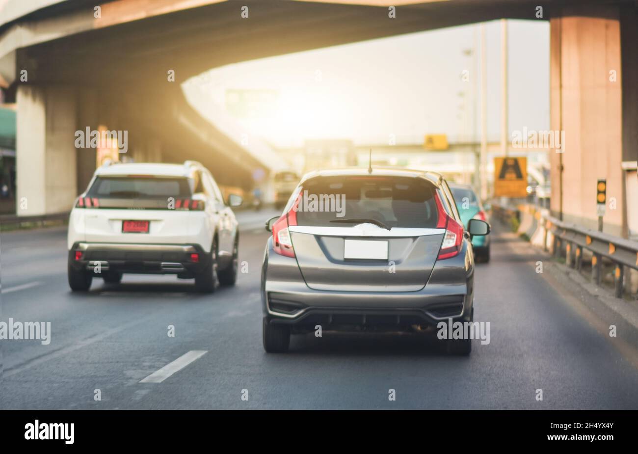 Car driving on road city hi-res stock photography and images - Alamy