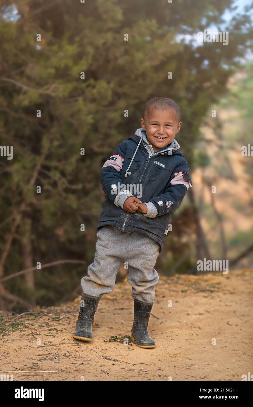 poor child smiles to life Stock Photo - Alamy