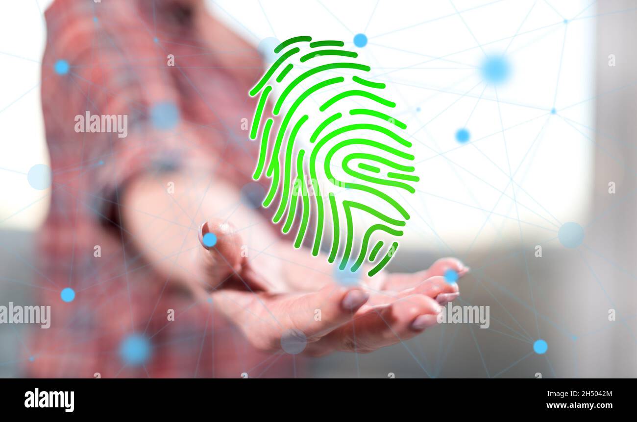 Fingerprint security system concept above the hand of a woman in ...