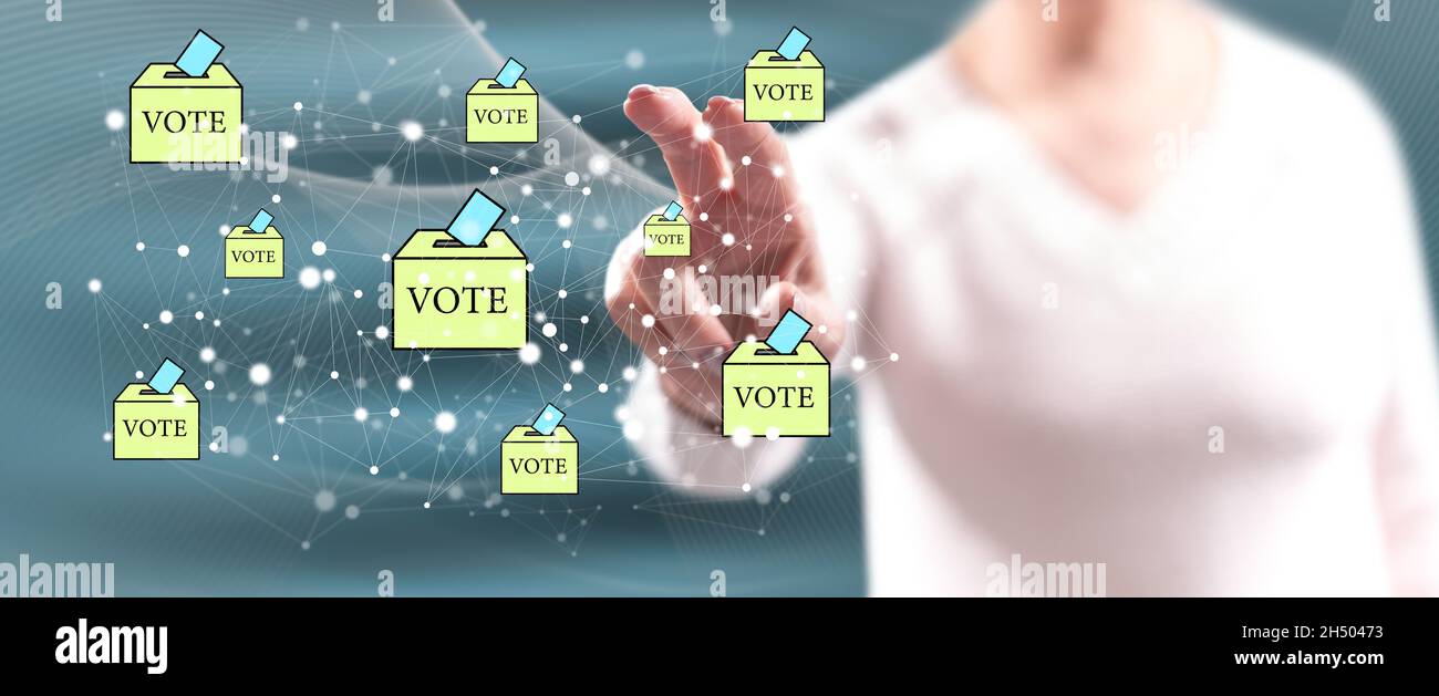 Woman touching an online voting concept on a touch screen with her ...