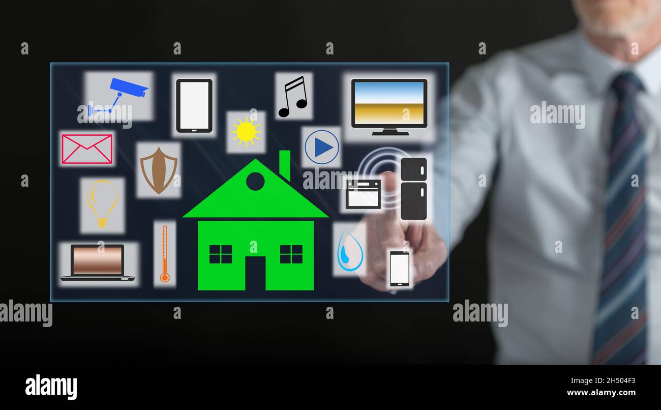 Man touching a smart home concept on a touch screen with his finger ...