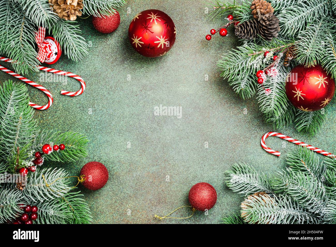 Christmas Greeting Card. Merry Christmas background with fir tree branches, candy canes and xmas ...
