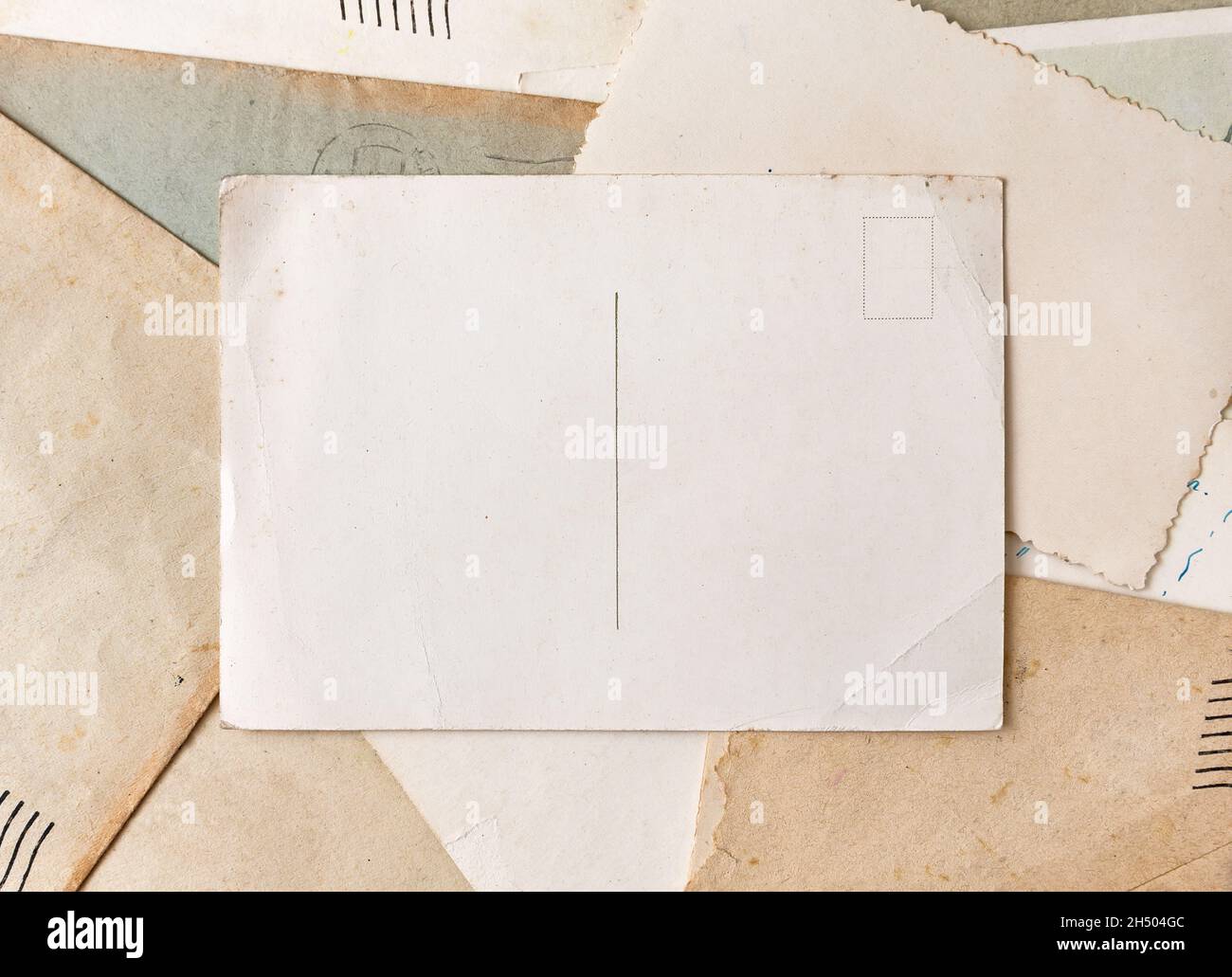 Vintage postcard on old grunge paper and envelopes background. Vintage ...