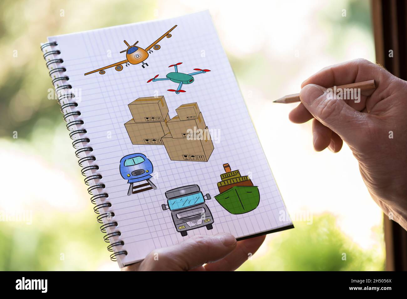 Hand drawing transportation concept on a notepad Stock Photo - Alamy
