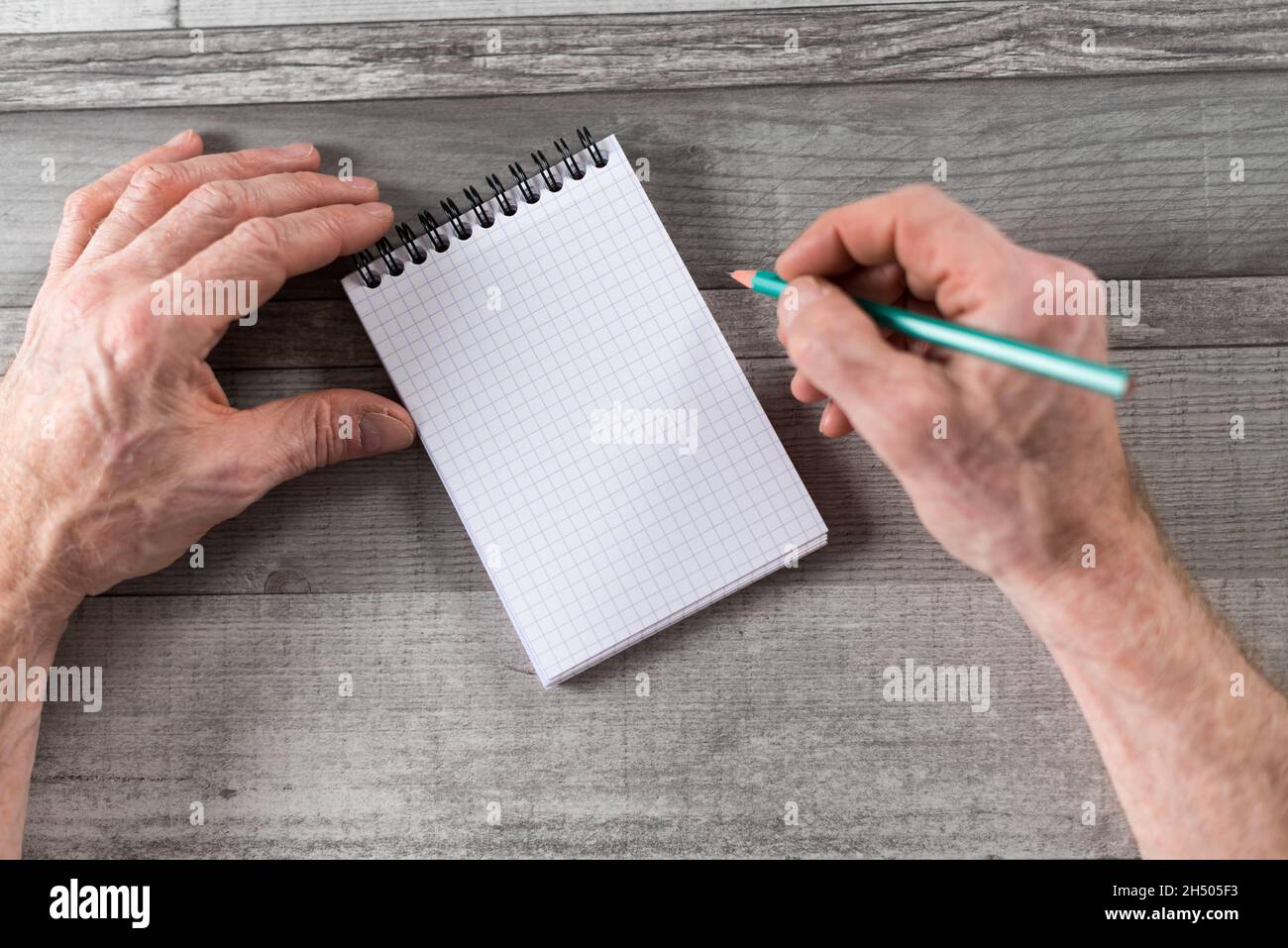 Hand taking notes on a pocket book Stock Photo - Alamy