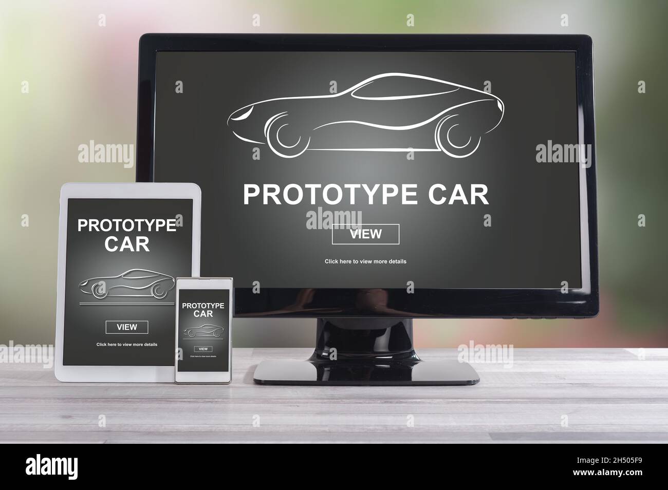 Prototype car concept shown on different information technology devices ...