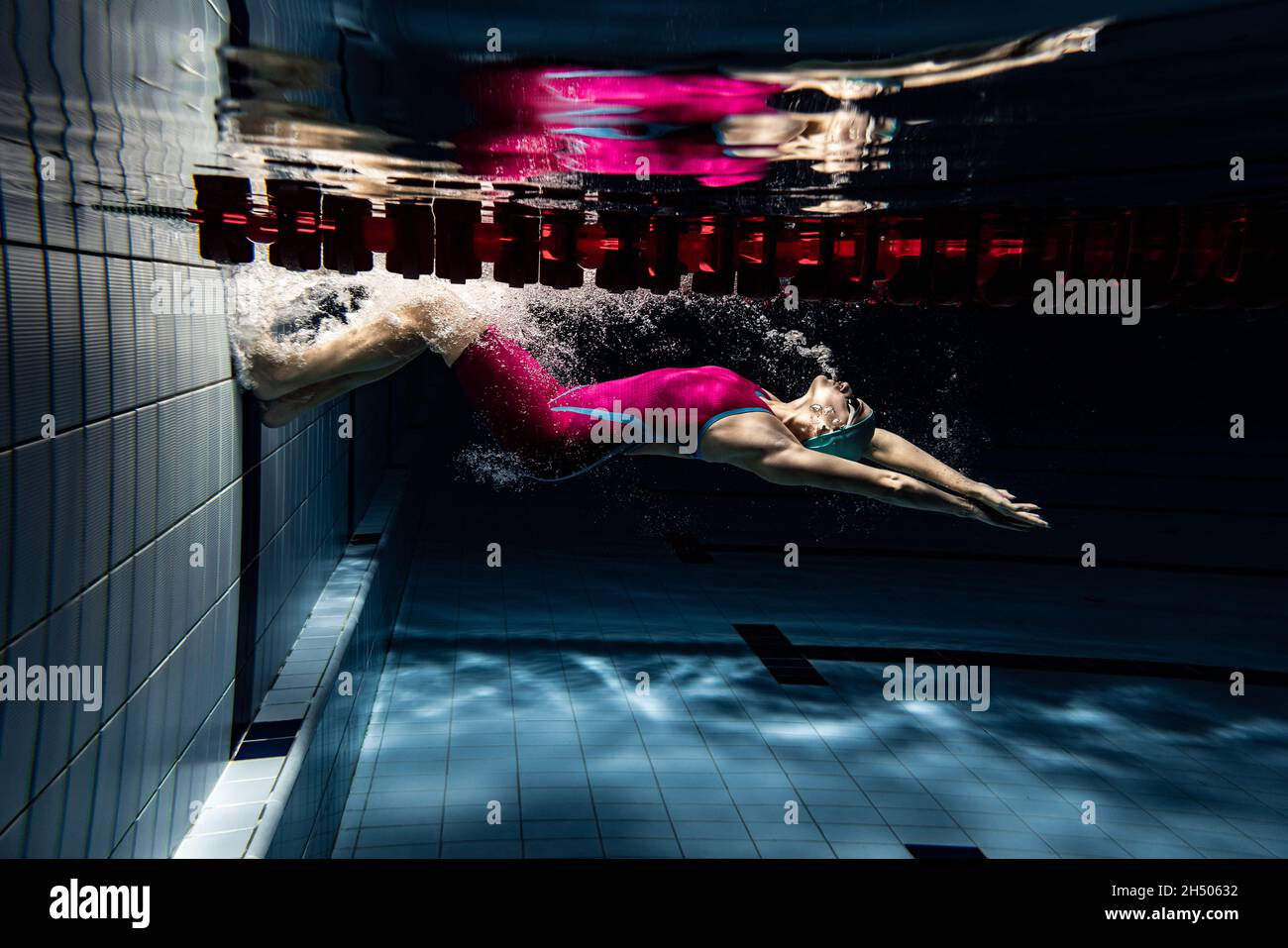 Underwater Shooting One Female Swimmer Training At Pool Indoors