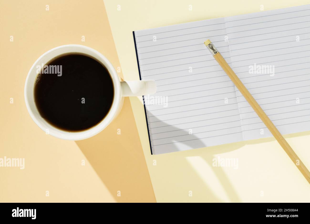 Note book , pencil and coffee Stock Photo - Alamy