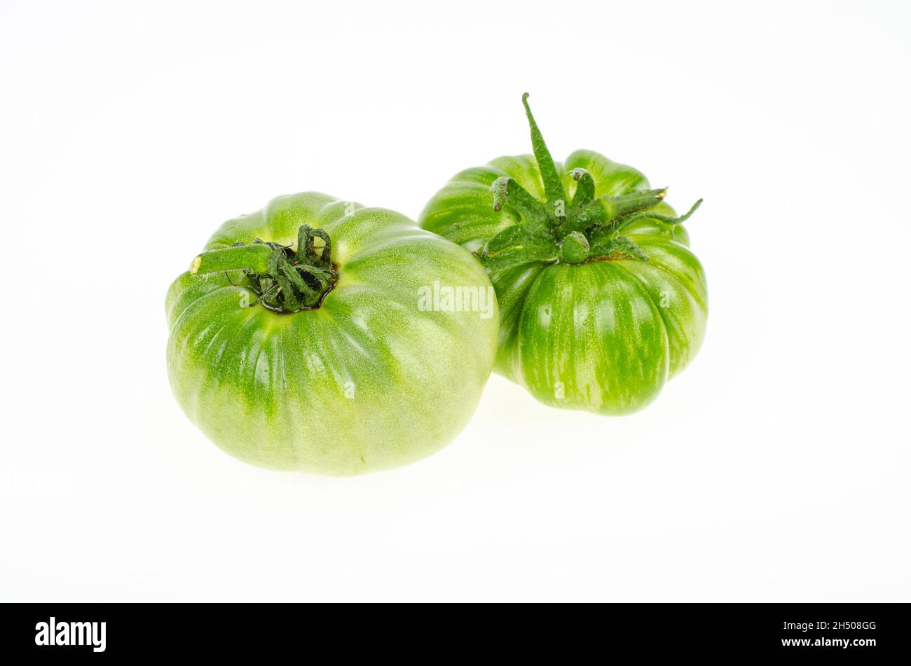 Two unripe green tomatoes isolated on white background. Studio Photo ...