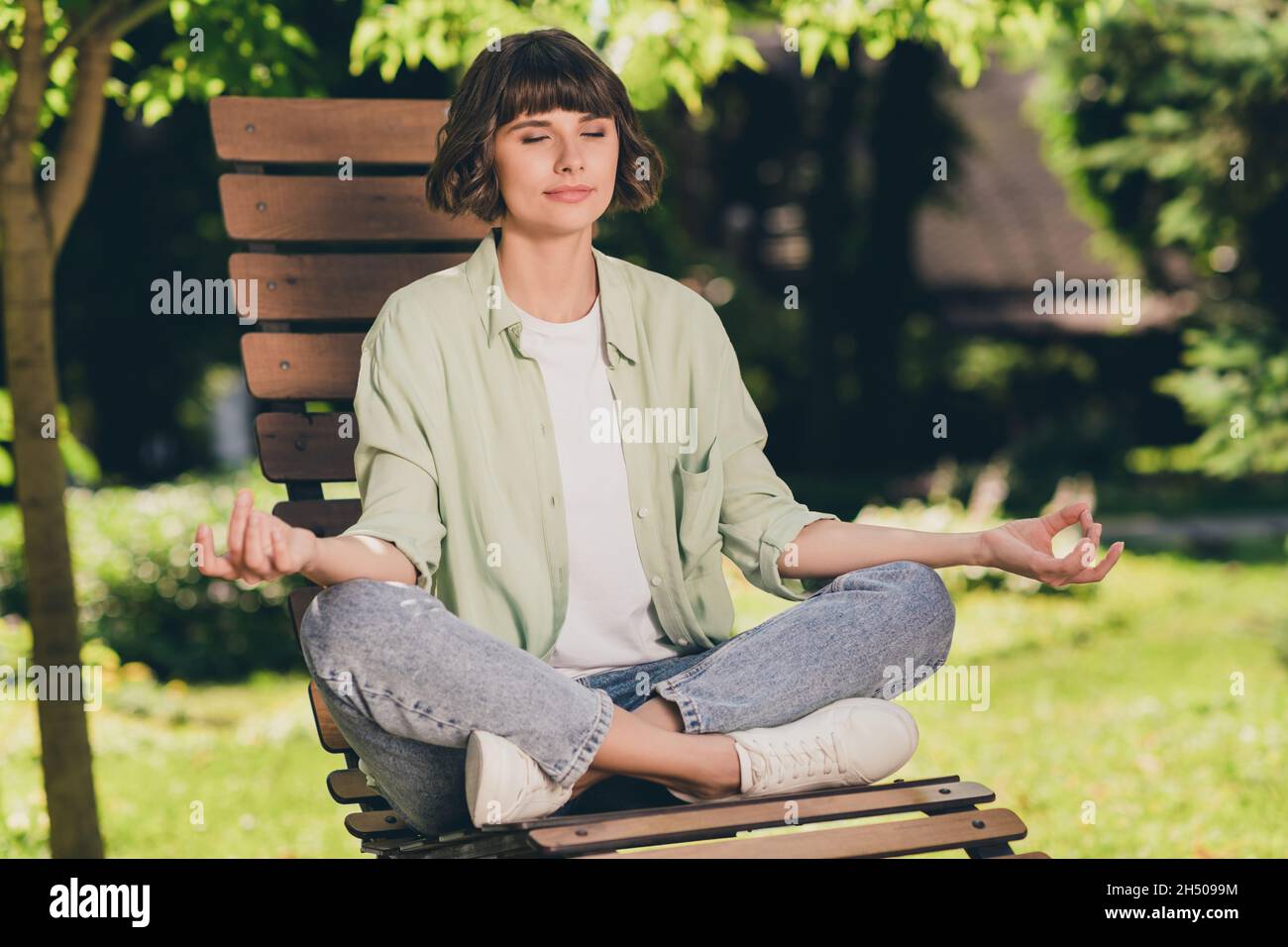 Full length body size photo smiling young girl sitting on wooden bench ...