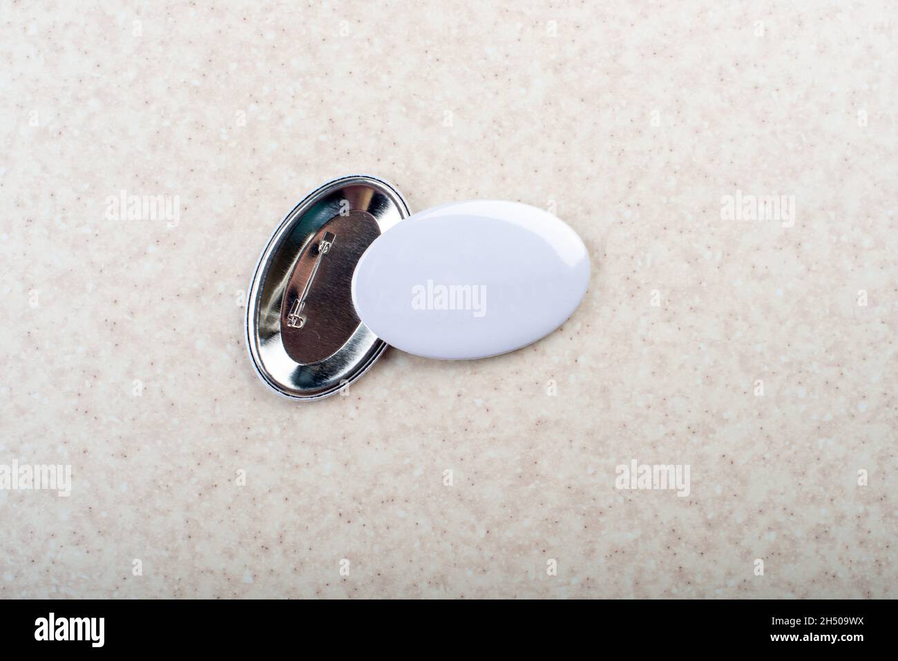 Empty campaign button pins with copy-space on light tabletop flat lay ...