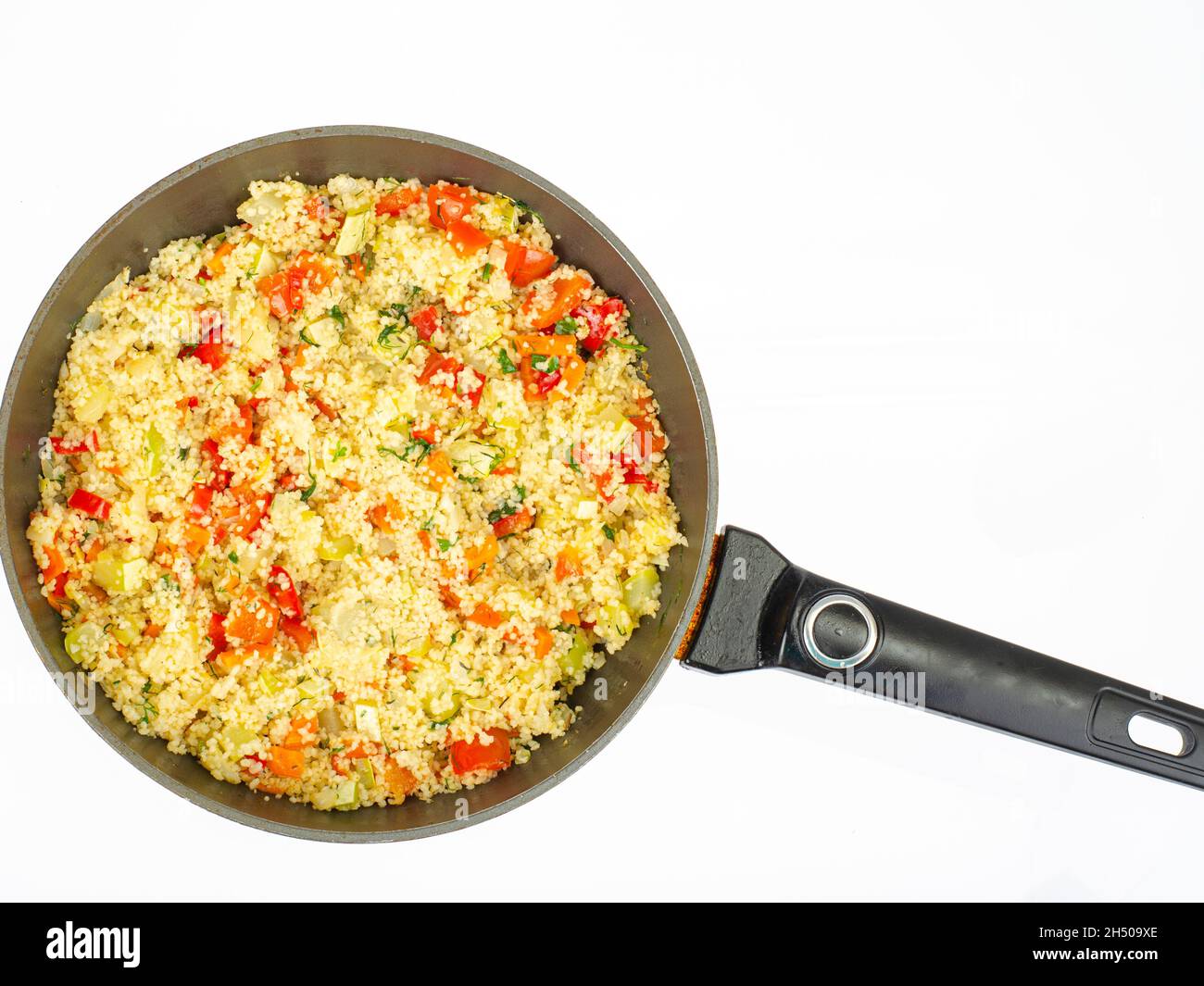Couscous with vegetables in frying pan. Moroccan cuisine dish. Studio ...