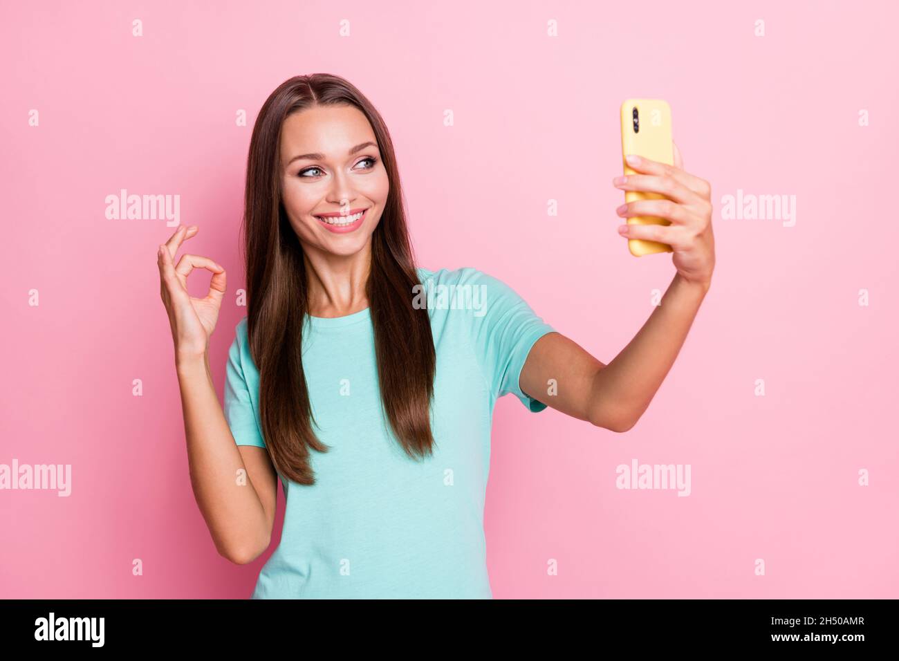 Photo of young happy smiling positive good mood woman take selfie on ...