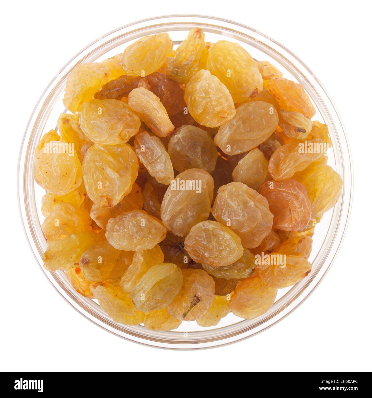 Raisins in glass bowl isolated on white background flat lay closeup ...
