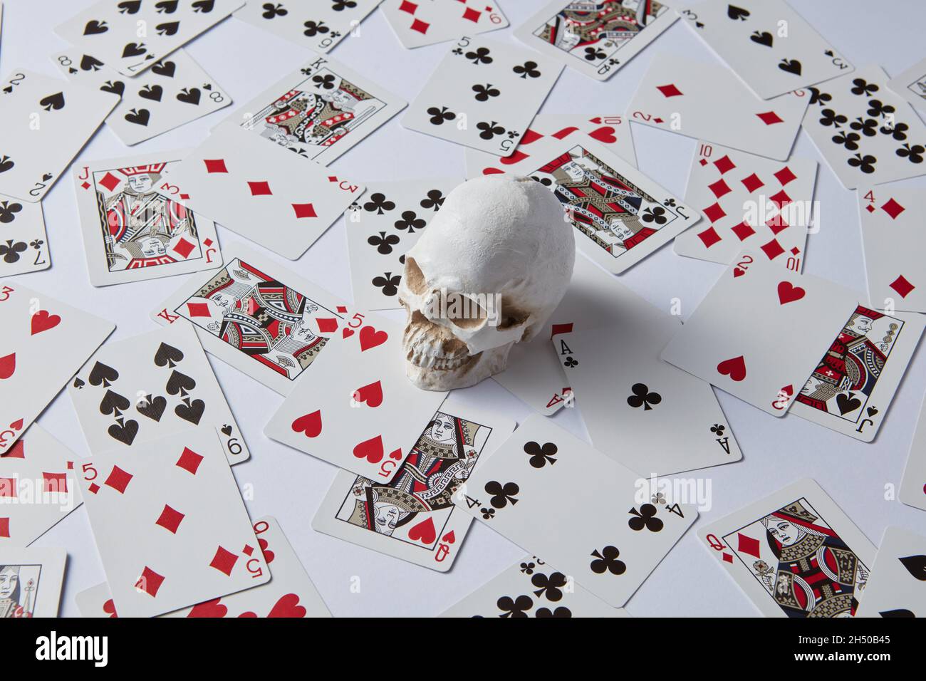 Human skull and deck of cards Stock Photo - Alamy